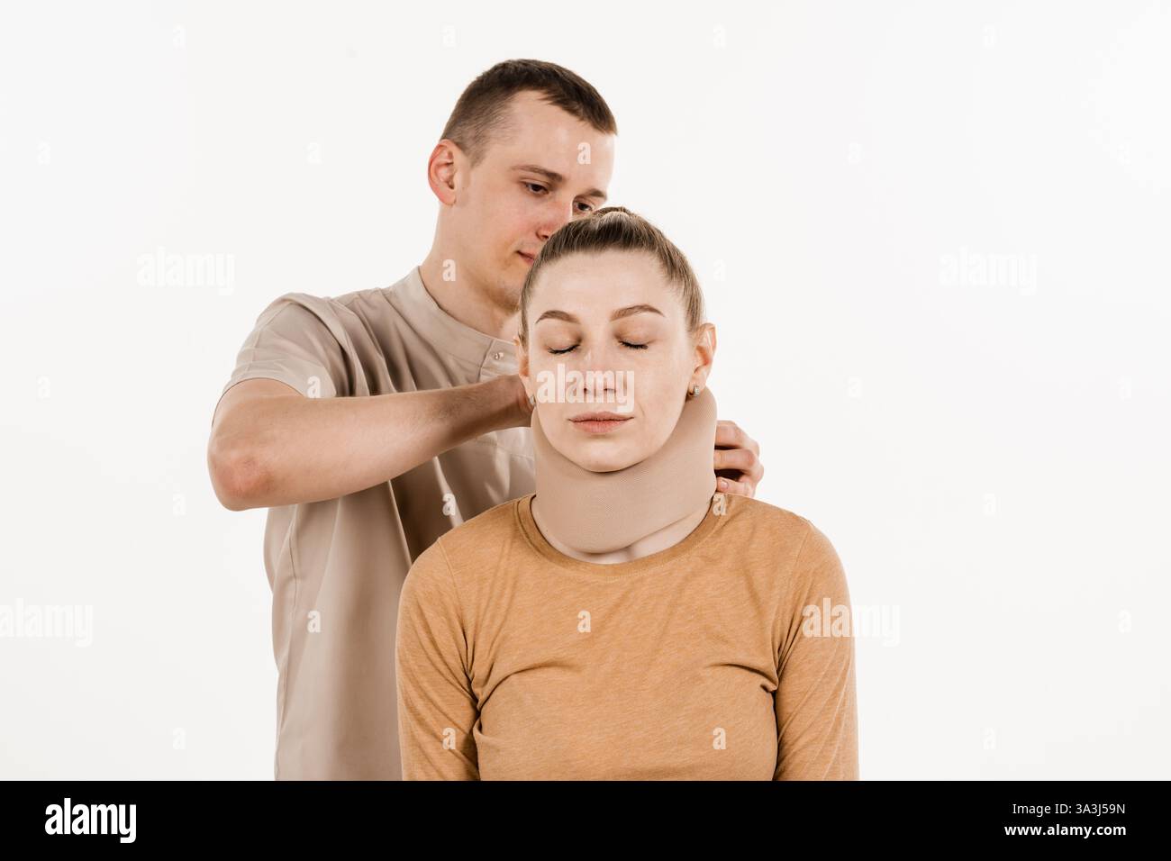Neurosurgeon puts neck bandage on girl to stabilize the cervical region ...