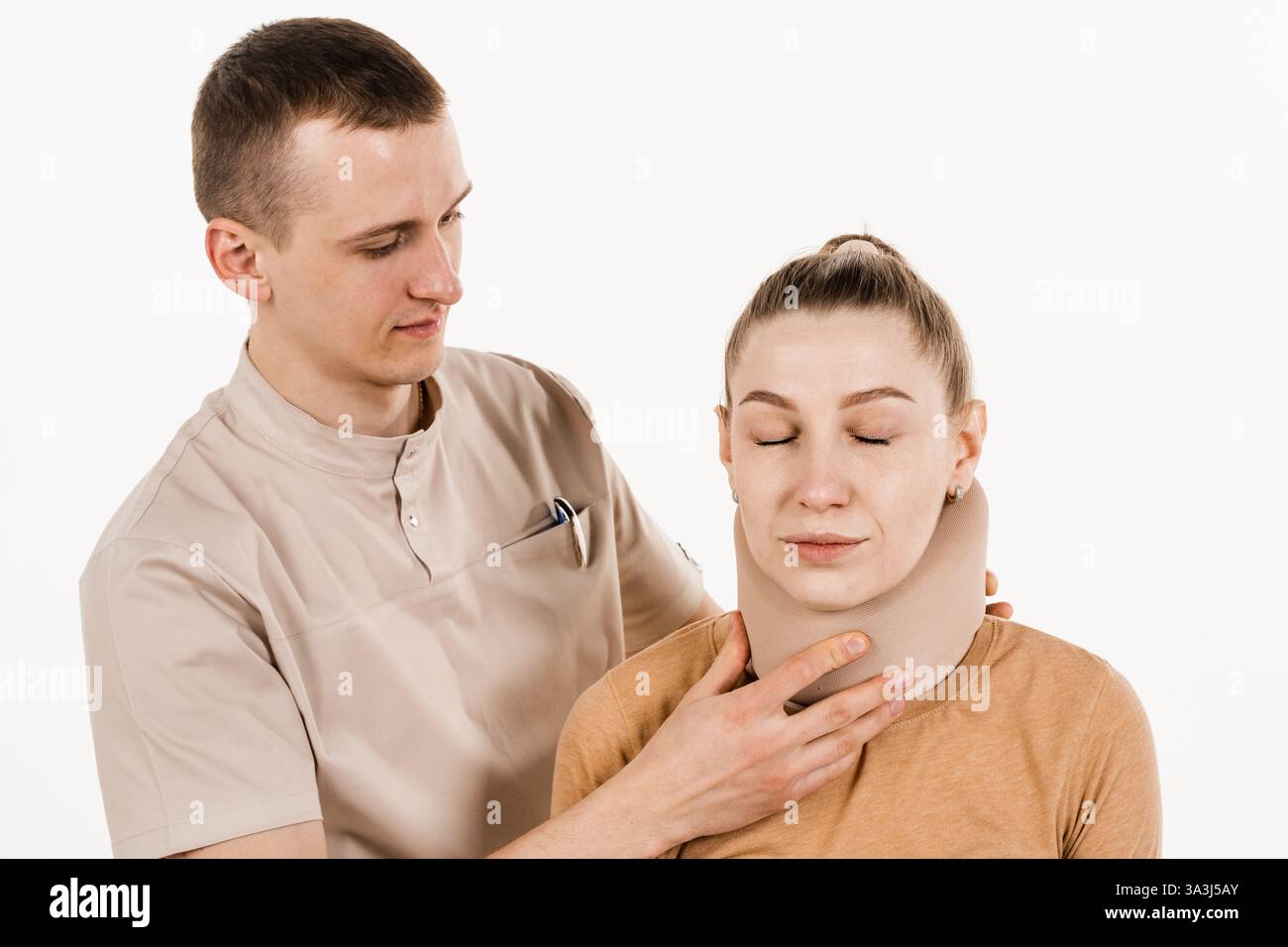 Neurosurgeon puts neck bandage on girl to stabilize the cervical region ...