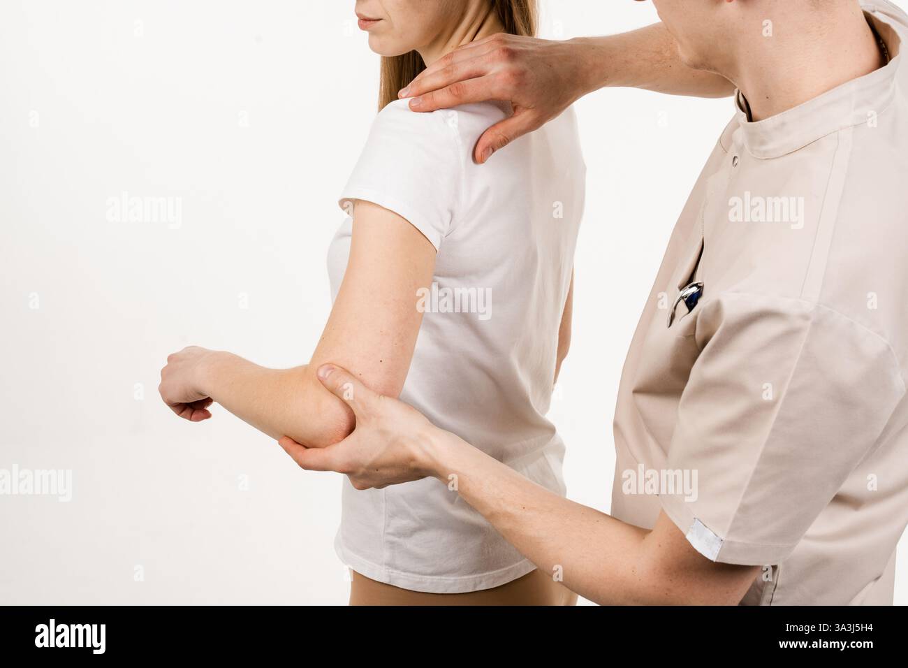 Orthopedic traumatologist examines shoulder joint of patient and checks ...