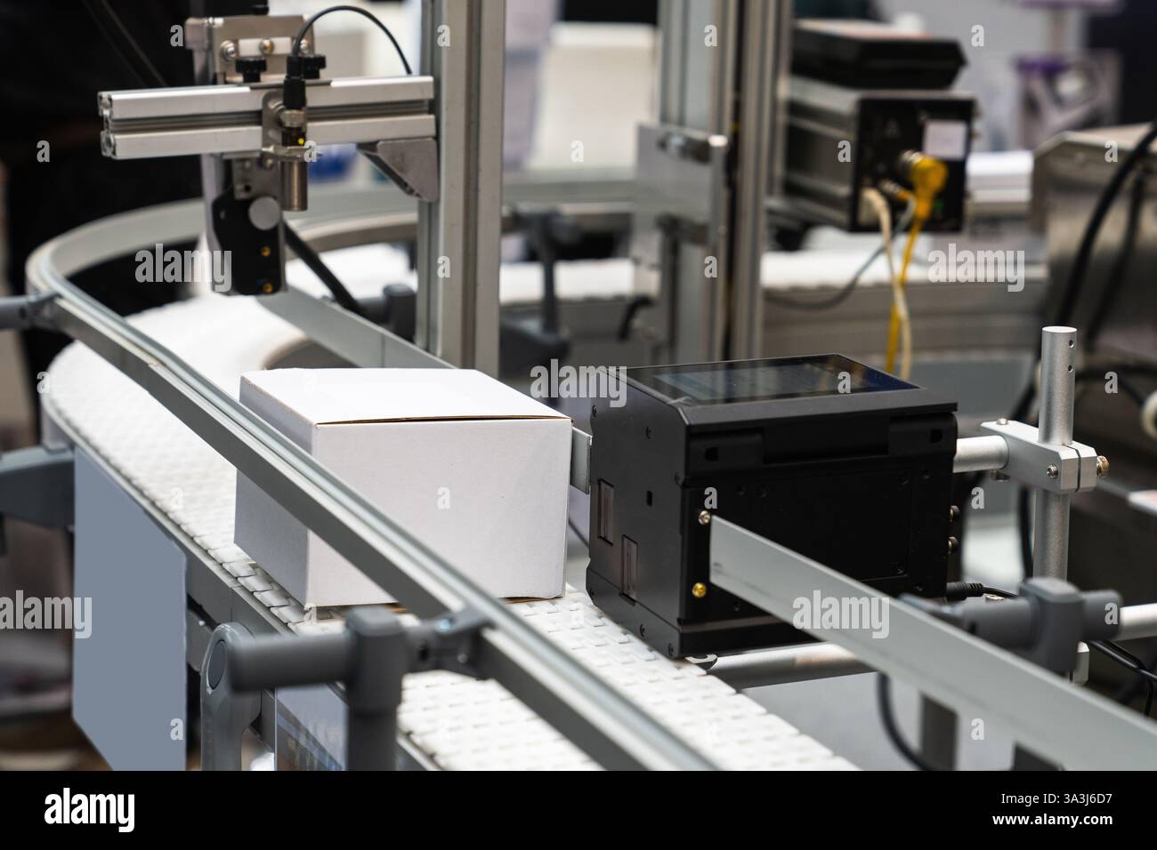 Machine for labeling barcodes on boxes Stock Photo - Alamy