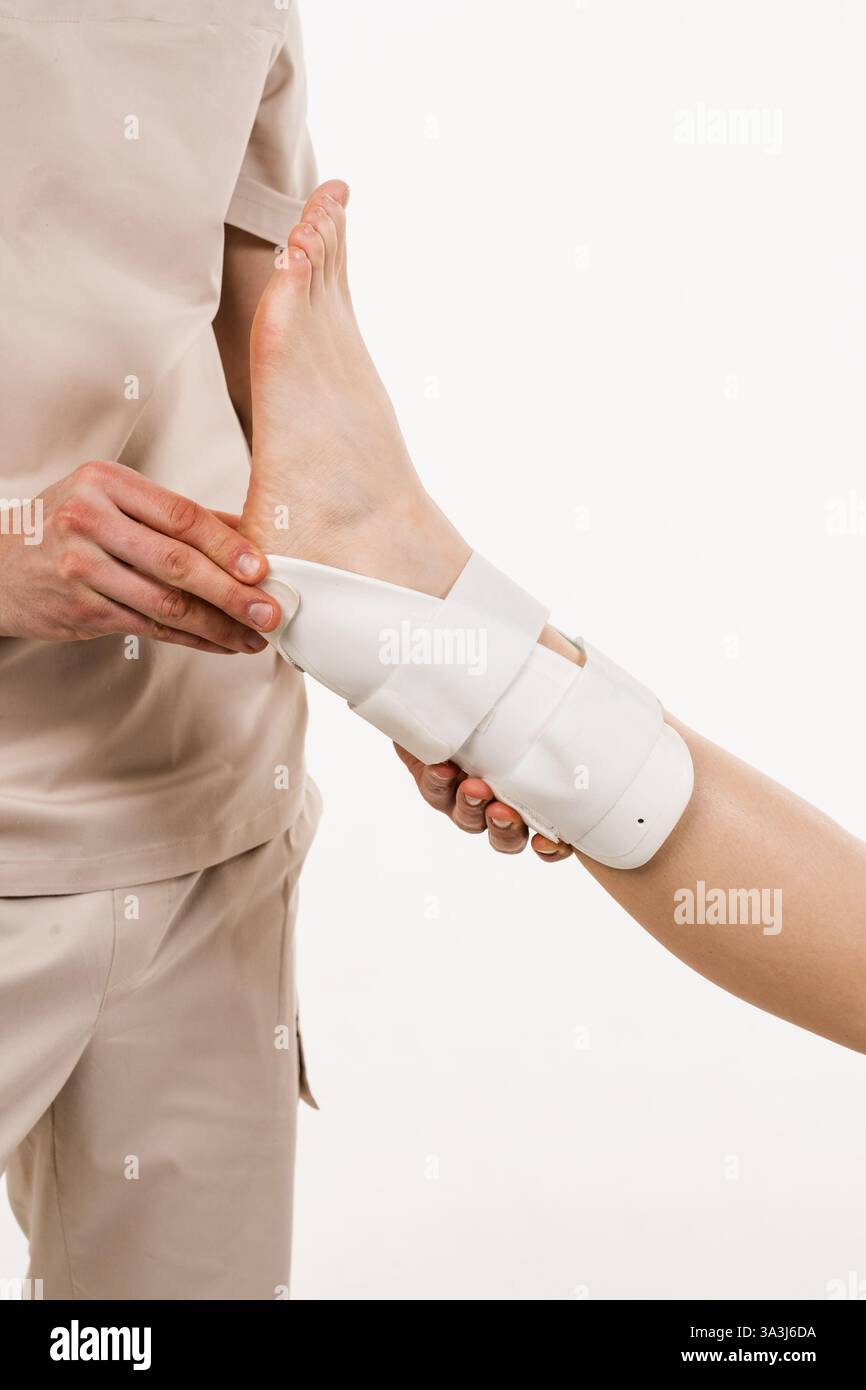 Ankle and foot external orthosis to reduce pathological mobility of ...