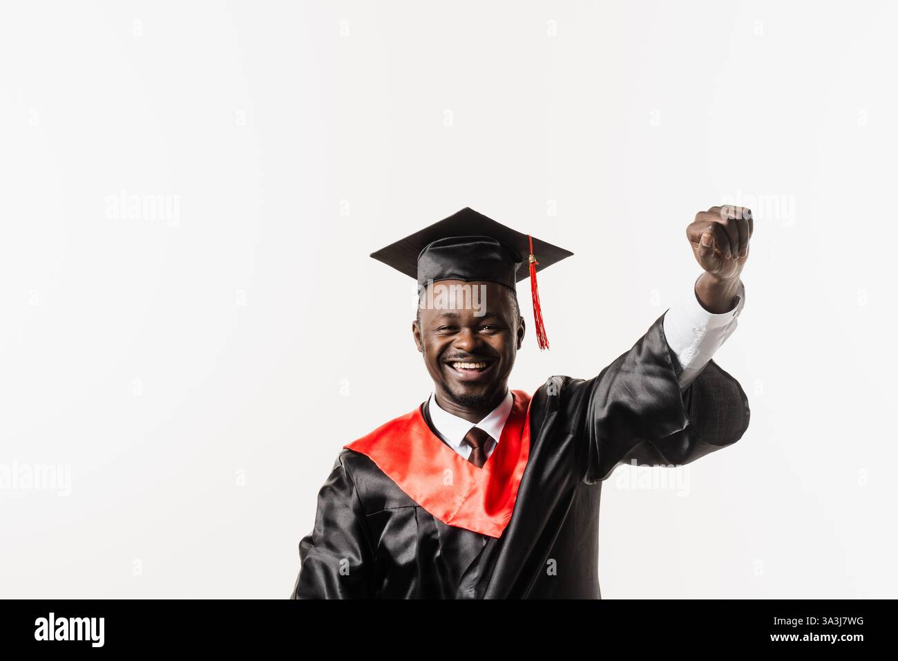 Graduate african man is graduating college and celebrating academic ...