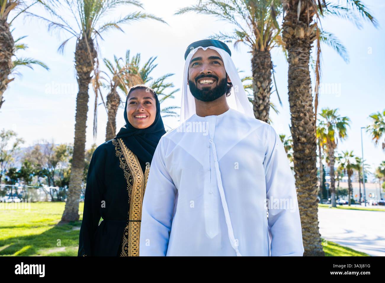 Traditional arab couple wearing emirati clothing dating outdoors - Middle-eastern married woman ...