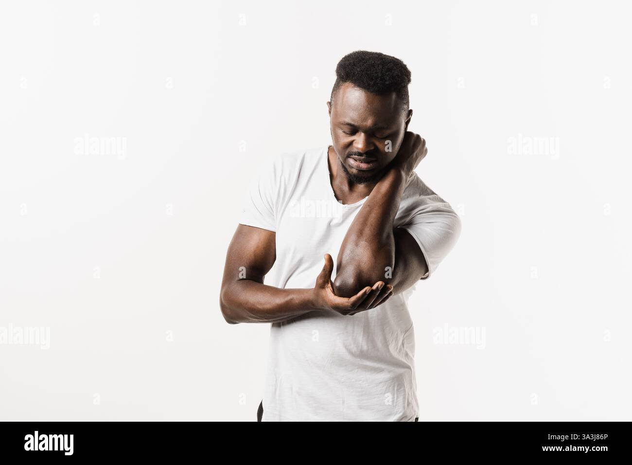 Elbow injury of african american man on white background. Traumatology ...