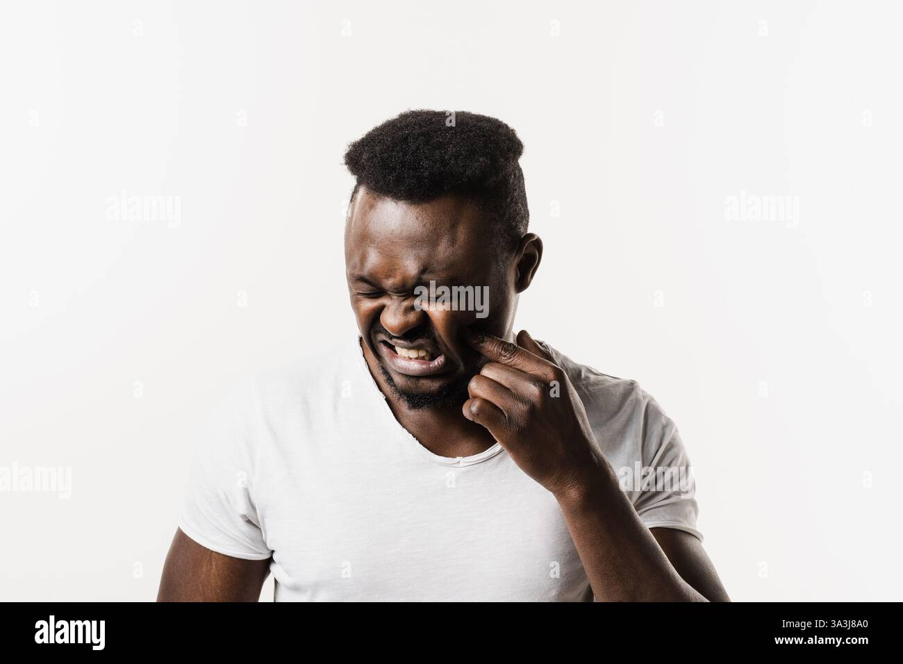 African man with tooth decay, infection or injury to the tooth or gums ...