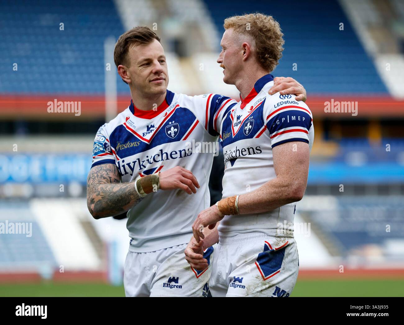 Wakefield Trinity's Tom Johnstone (left) and Lachlan Walmsley celebrate following the Betfred ...