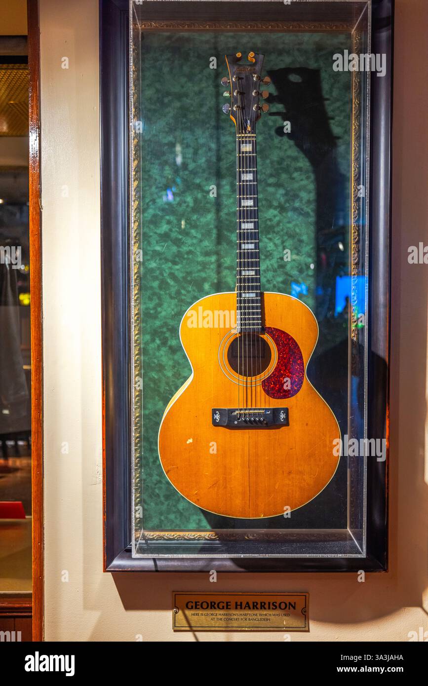 George Harrisons acoustic guitar in glass display at Hard Rock Cafe in ...