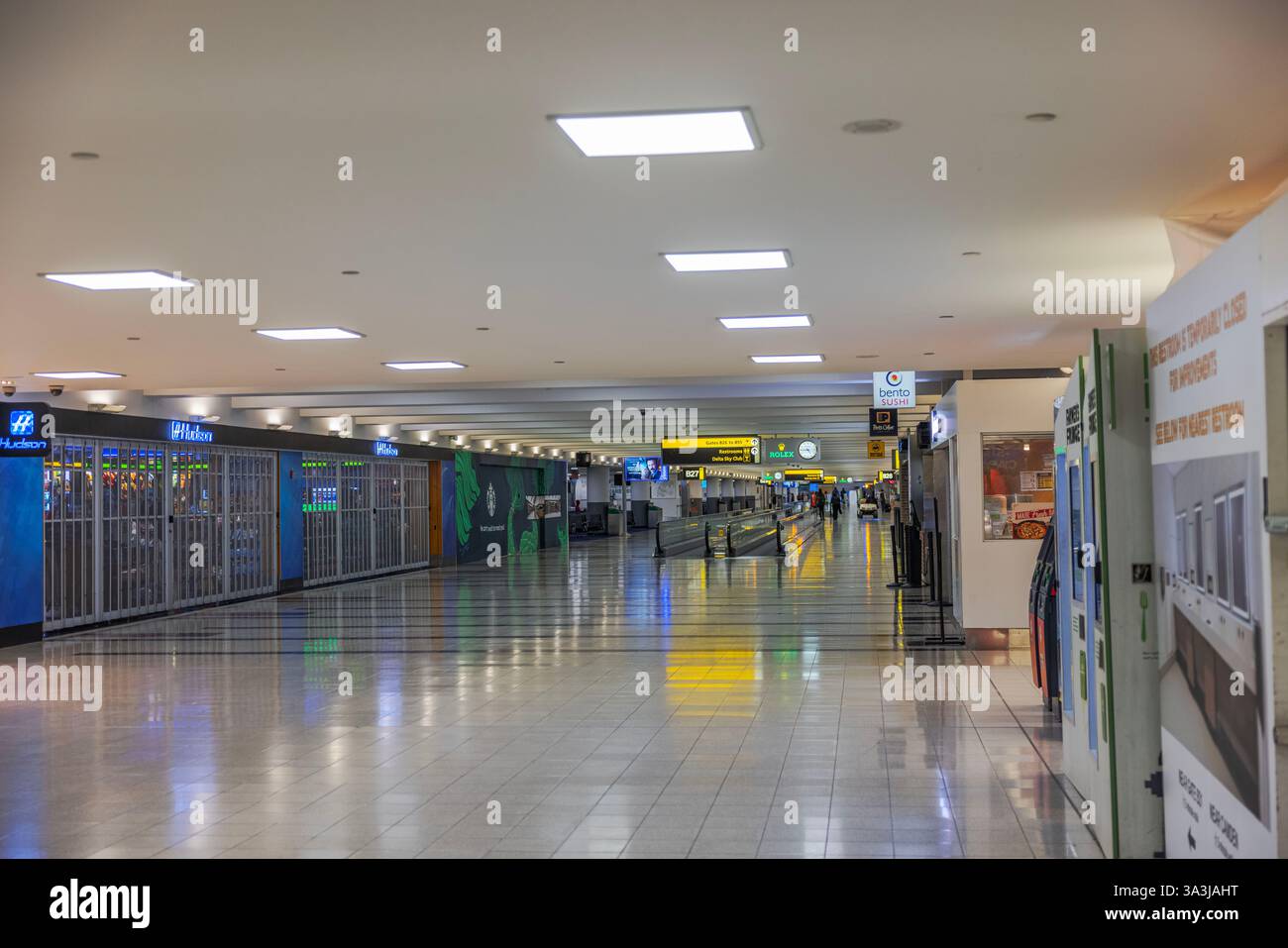 Empty corridor inside John F. Kennedy Airport in New York with closed ...