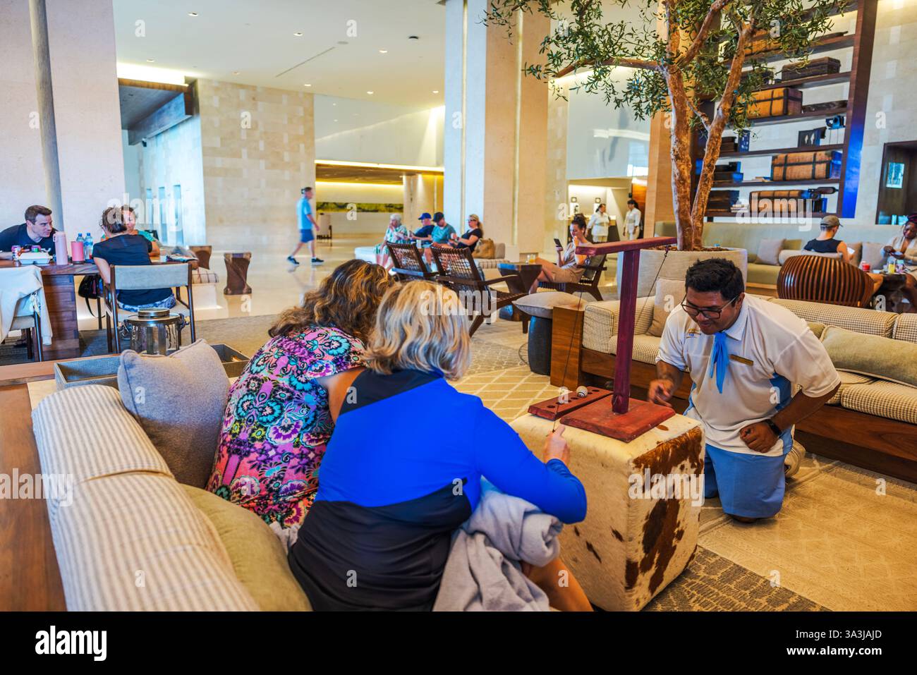 Guests playing the traditional Mexican ring toss game "Juego de la ...