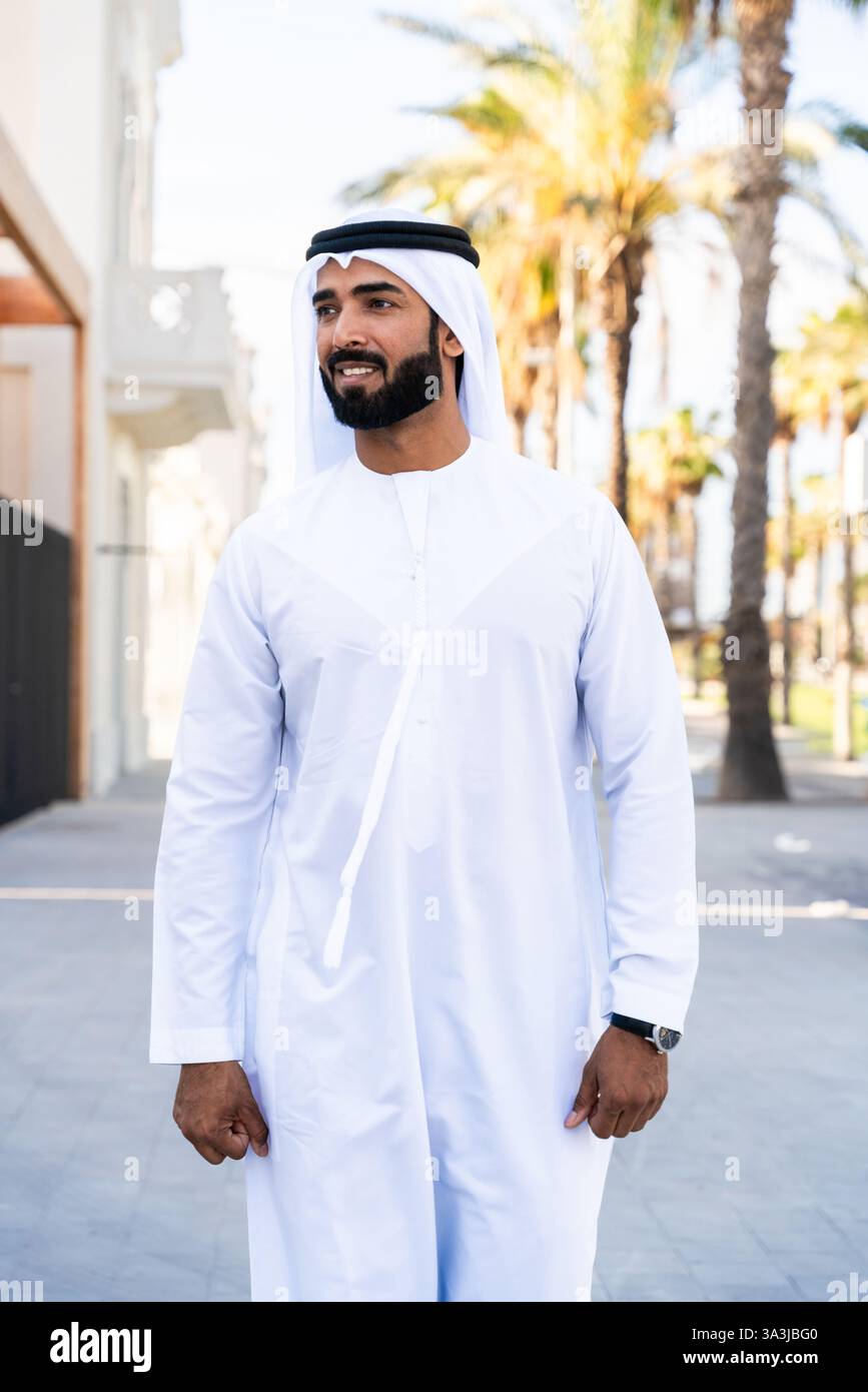 Traditional arab man wearing emirati kandura outdoors - Handsome middle ...