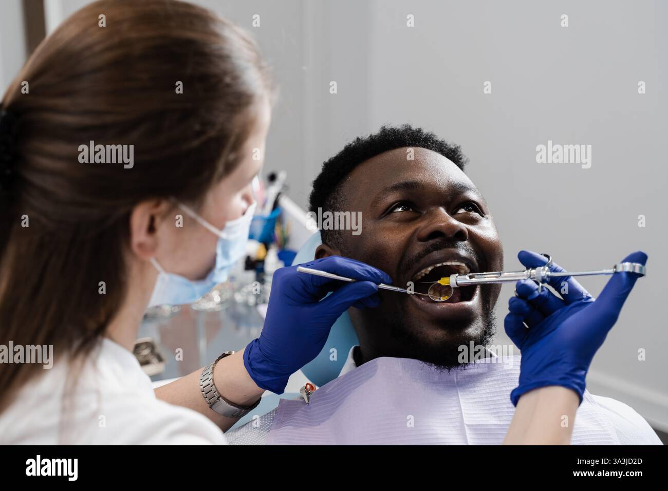 Anesthesia syringe injection close-up. Dentist injects syringe with ...