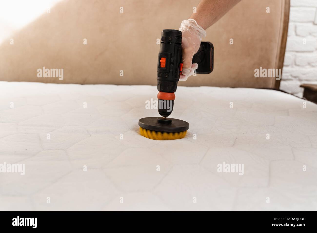 Applying detergent on mattress for dry cleaning. Smearing detergent on ...