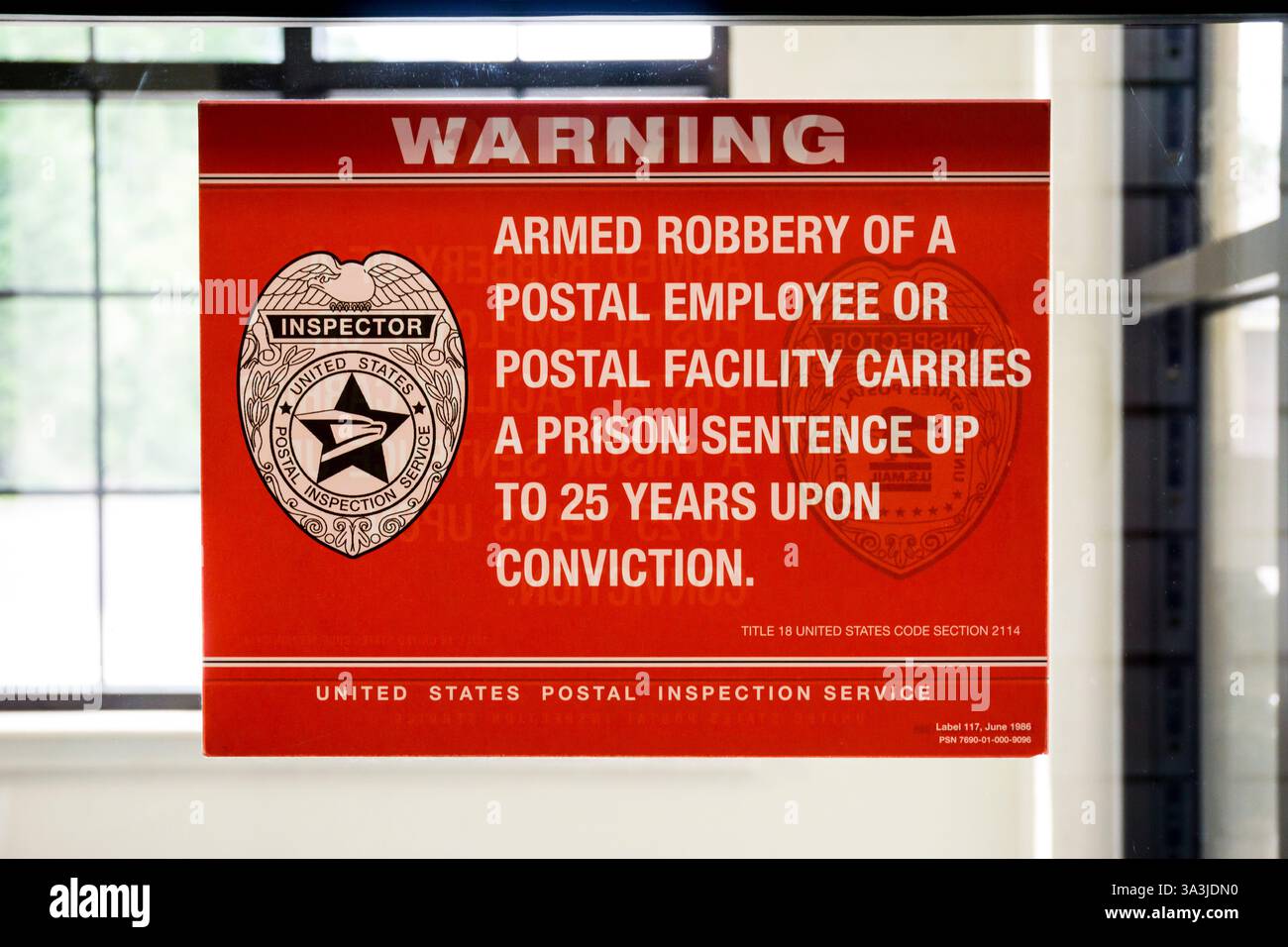 Warning sign in a US post office says armed robbery of a postal ...