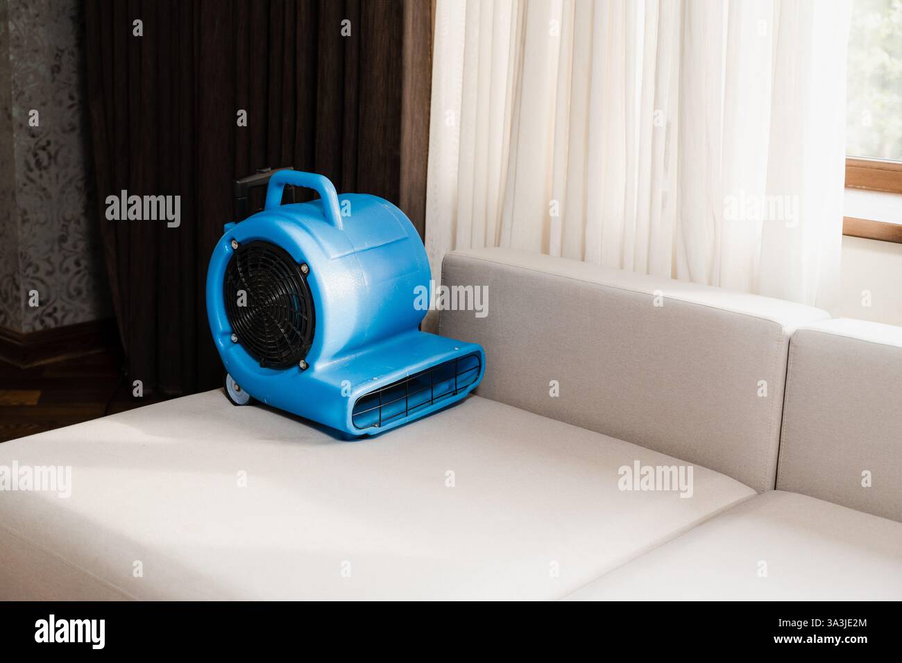 Process of drying sofa using floor dryer blower fan machine. Floor ...