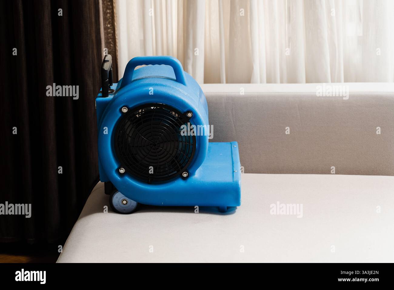 Process of drying sofa using floor dryer blower fan machine. Floor ...