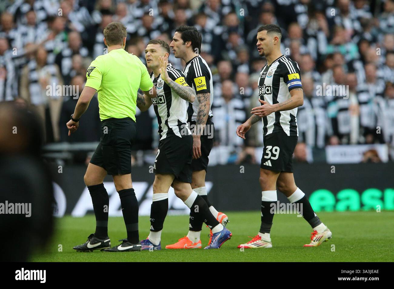 Kieran Trippier of Newcastle United is spoken to by Referee John Brooks ...