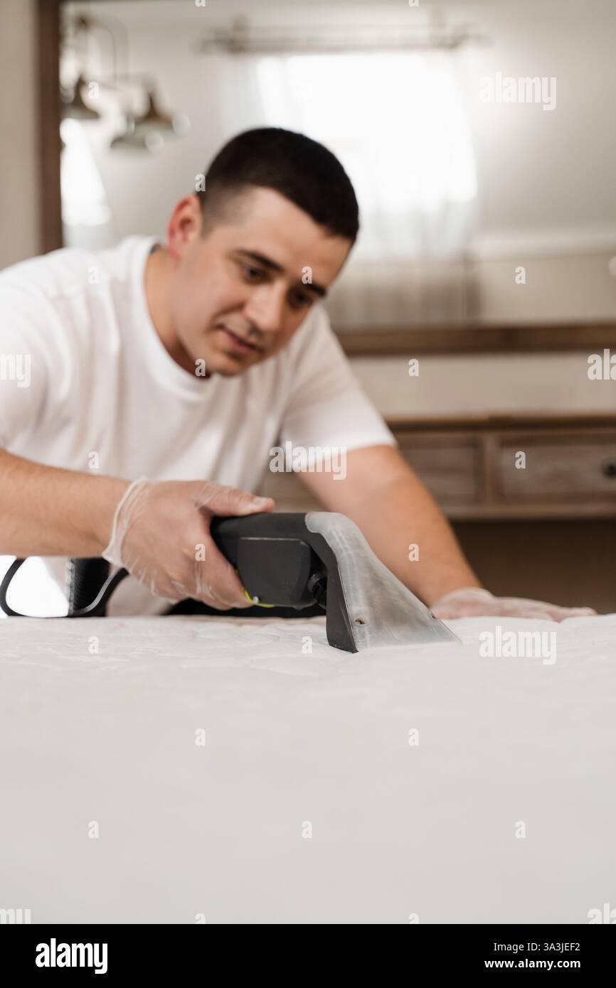 Dry cleaner is using extraction machine for removing stains and dirt ...