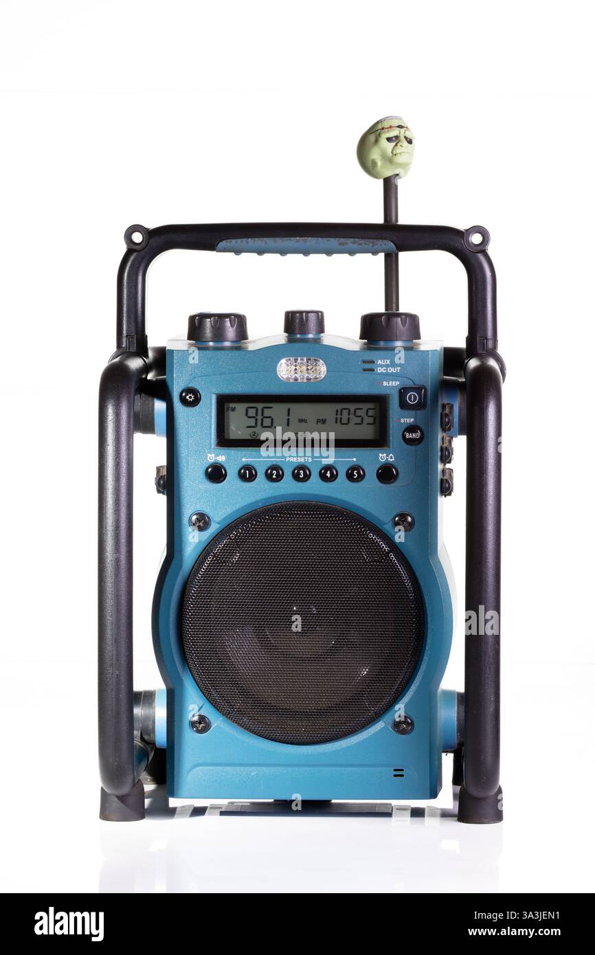 Compact blue radio with visible controls, durable build, and front ...