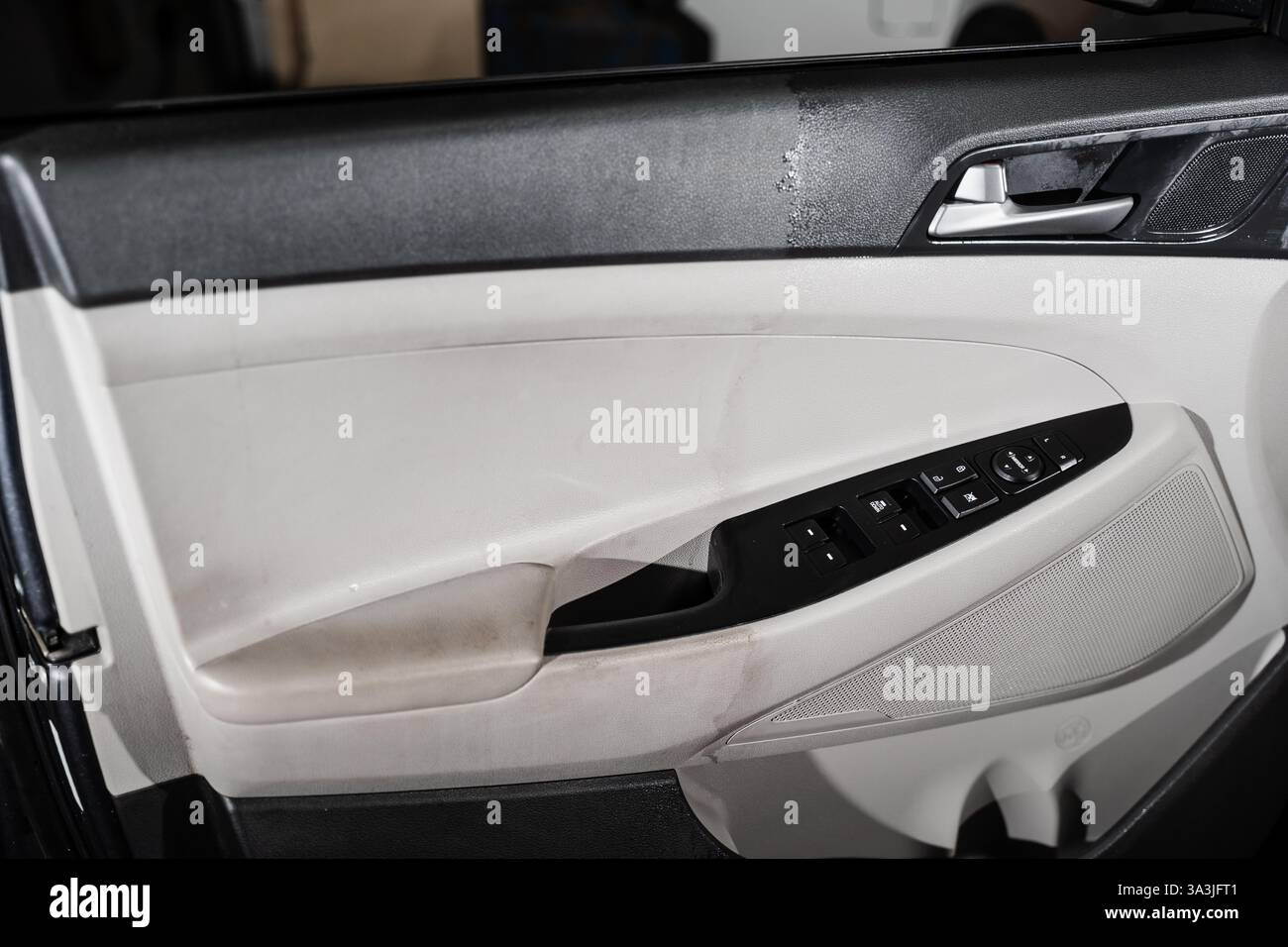 Half of car door panel with dirty and dust, other half of car door card ...