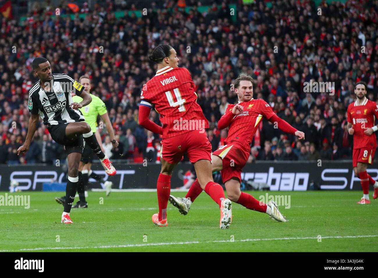 Newcastle's Alexander Isak, left, scores his side's second goal during ...