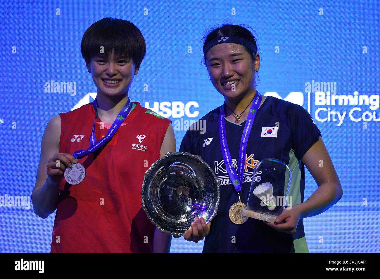 South Korea's Young An Se, right, poses on the podium with her opponent China's Wang Zhi Yi ...
