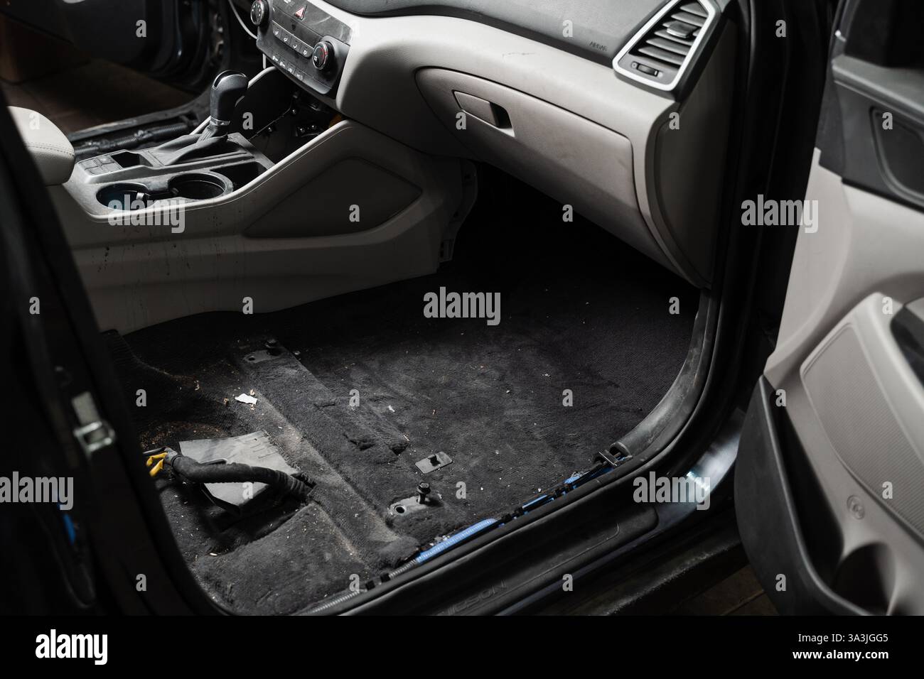 Dirty car floor with removed seats before vacuum cleaning in detailing ...