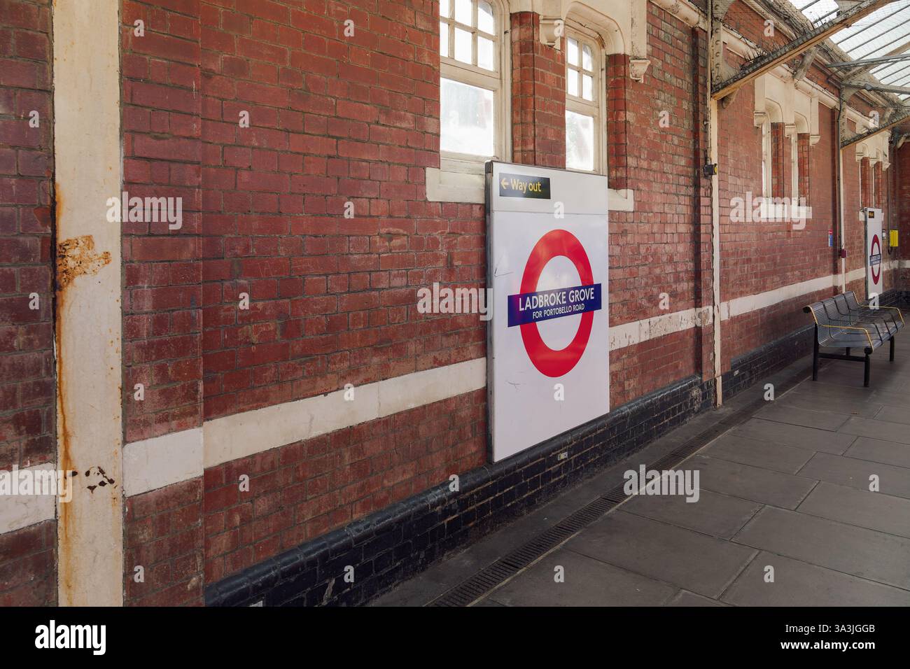 London, UK Ladbroke Grove Tube station empty platform with brick walls ...