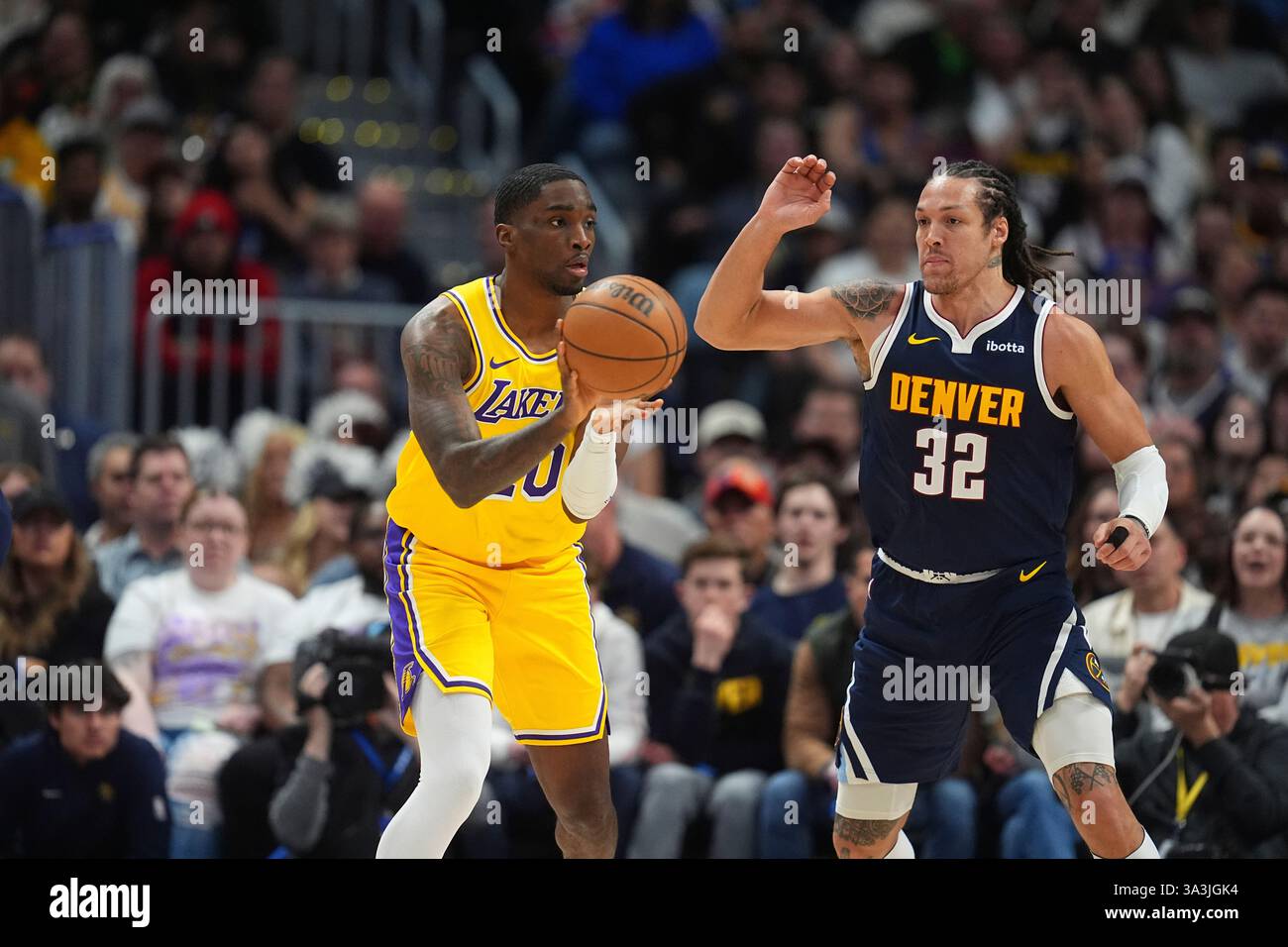 Los Angeles Lakers guard Shake Milton (20) and Denver Nuggets forward ...