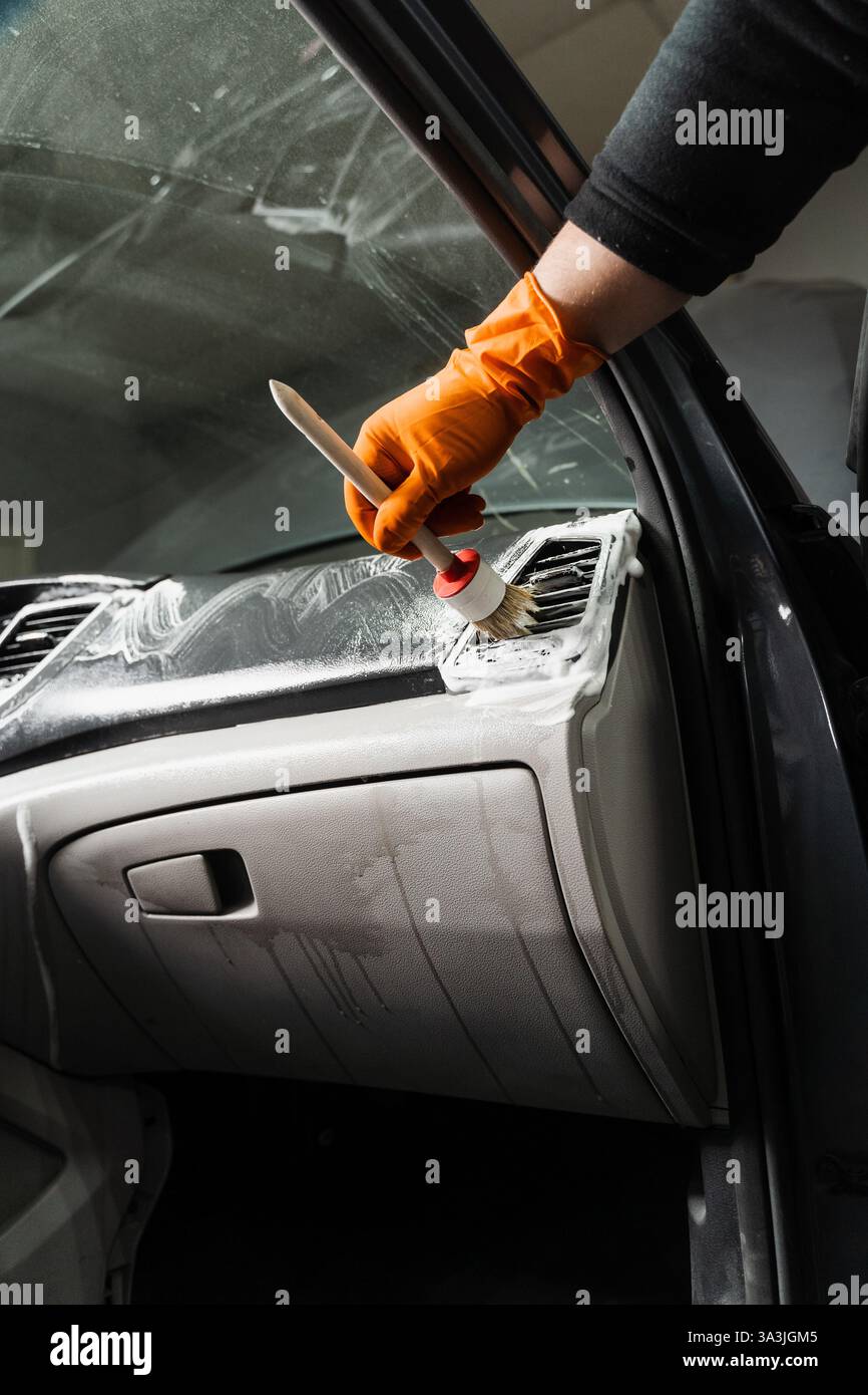 Cleaning with air and brush of air conditioning system in the car ...