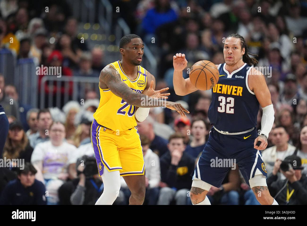 Los Angeles Lakers guard Shake Milton (20) and Denver Nuggets forward ...
