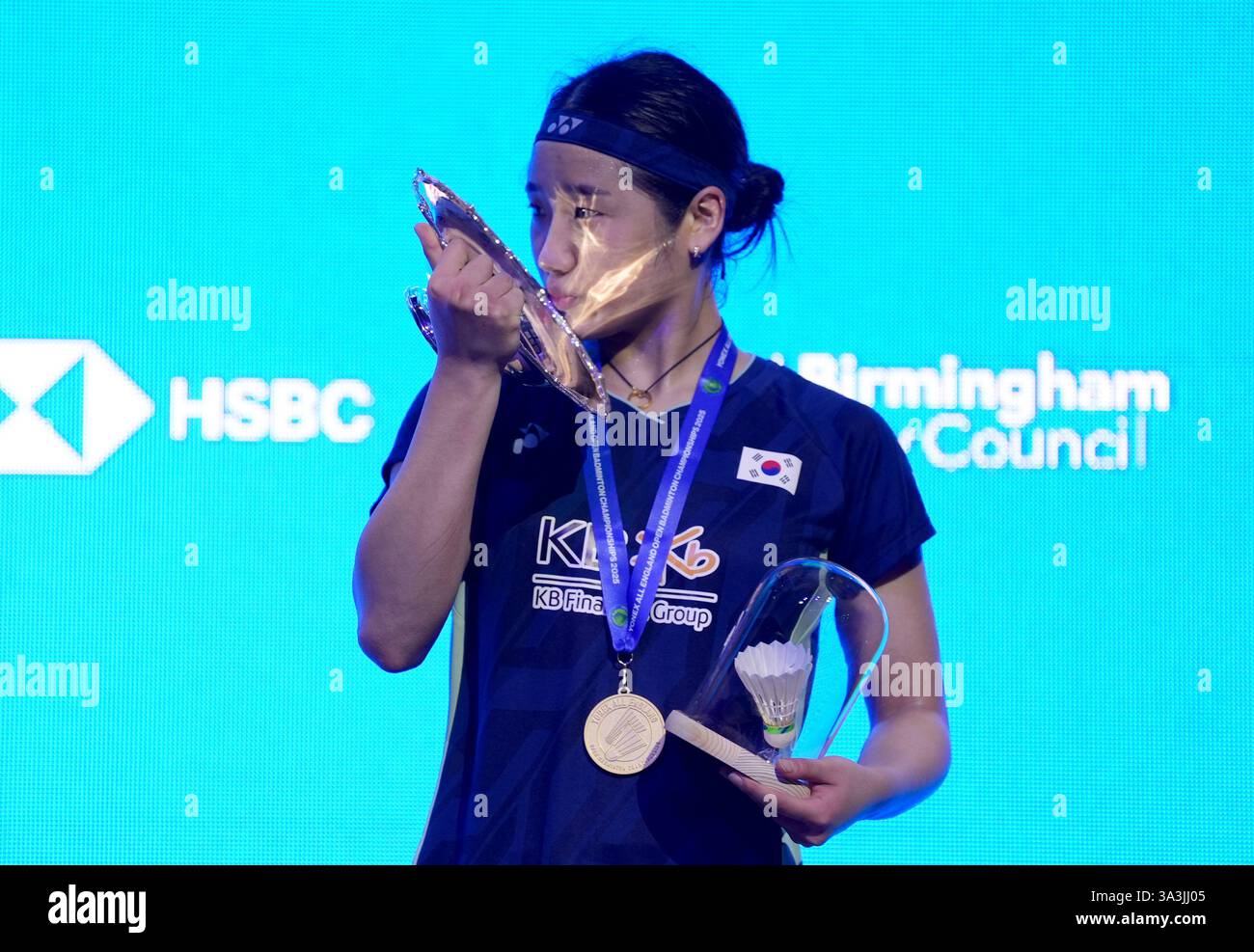 Korea's An Se-young poses with her trophy following victory against China's Zhi Yi Wang (not ...