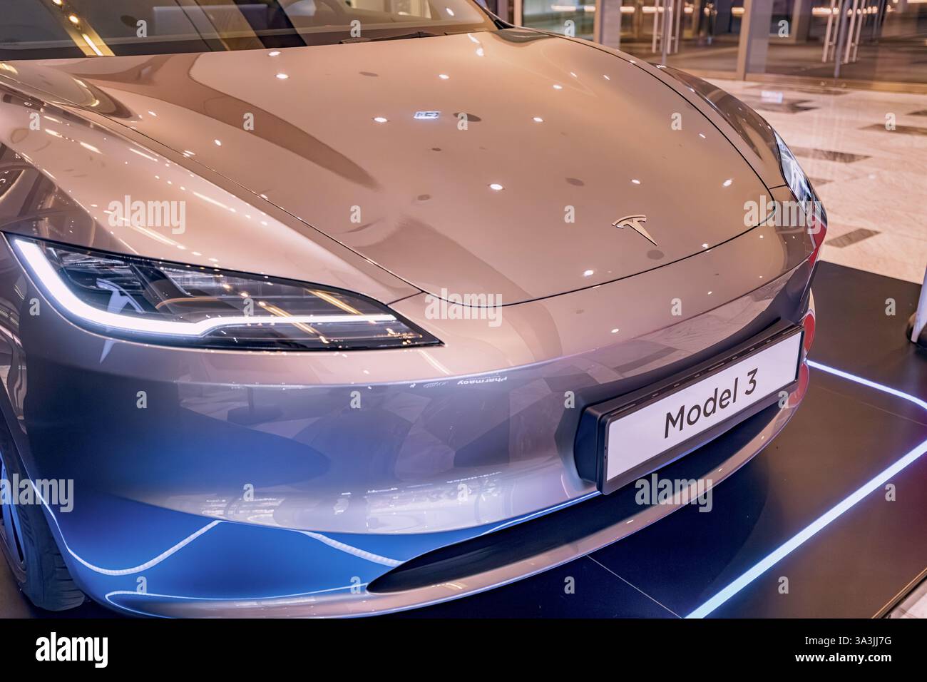 17 January 2025, Abu Dhabi, UAE: Modern gray Tesla Model 3 electric car ...