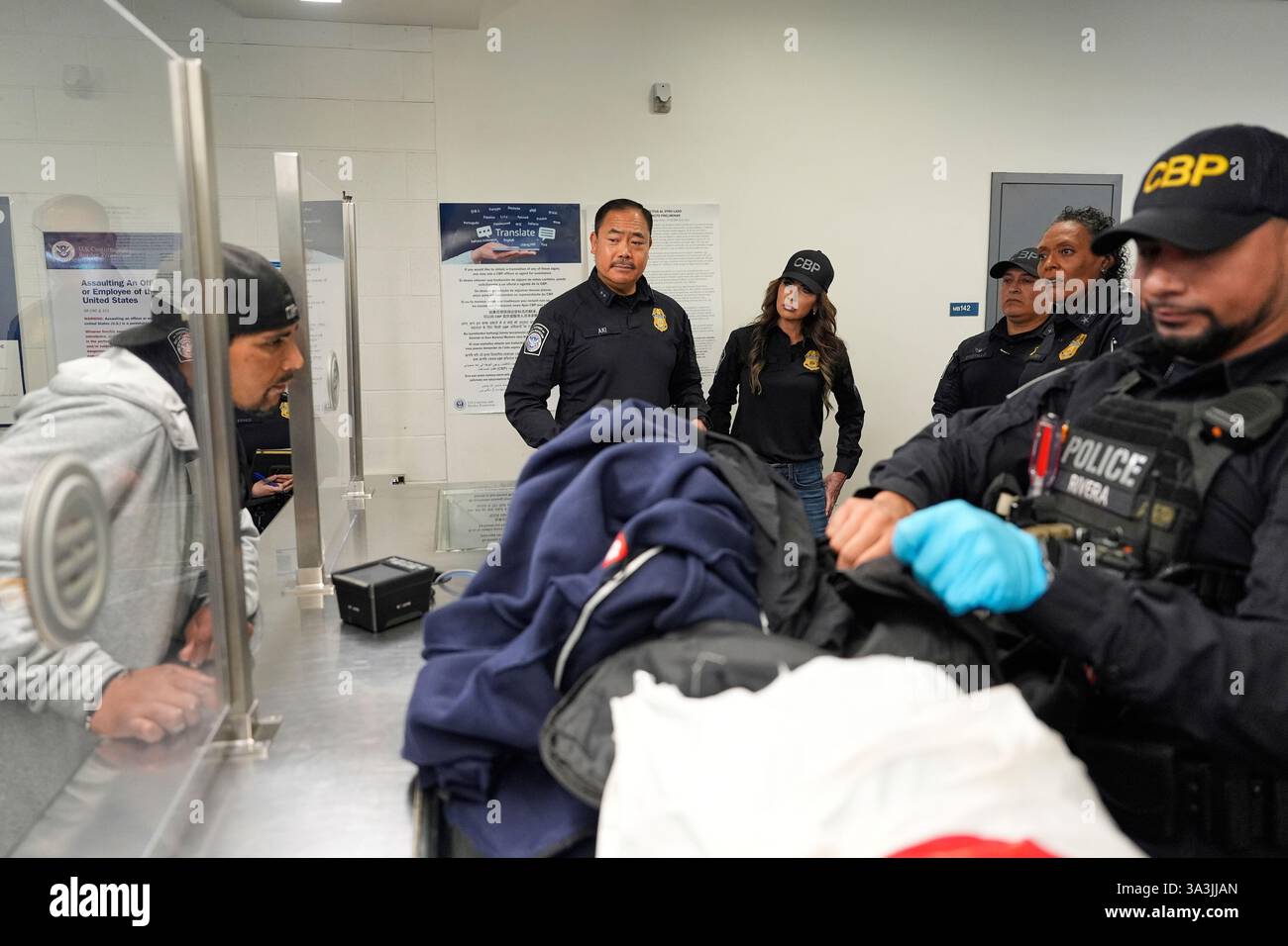 Homeland Security Secretary Kristi Noem, center right, and Sidney Aki ...