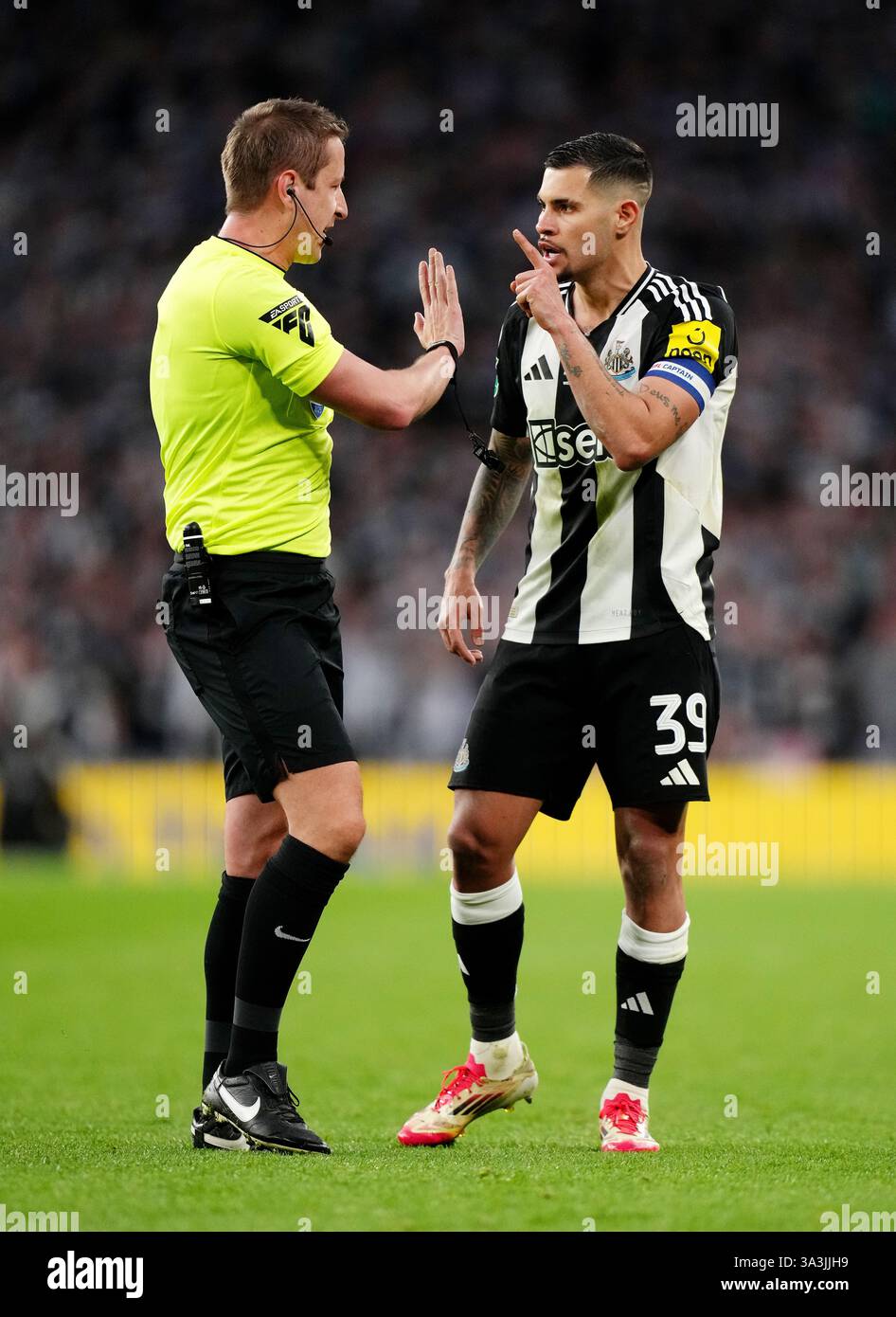 Newcastle United's Bruno Guimaraes (right) speaks to referee John Brooks during the Carabao Cup ...