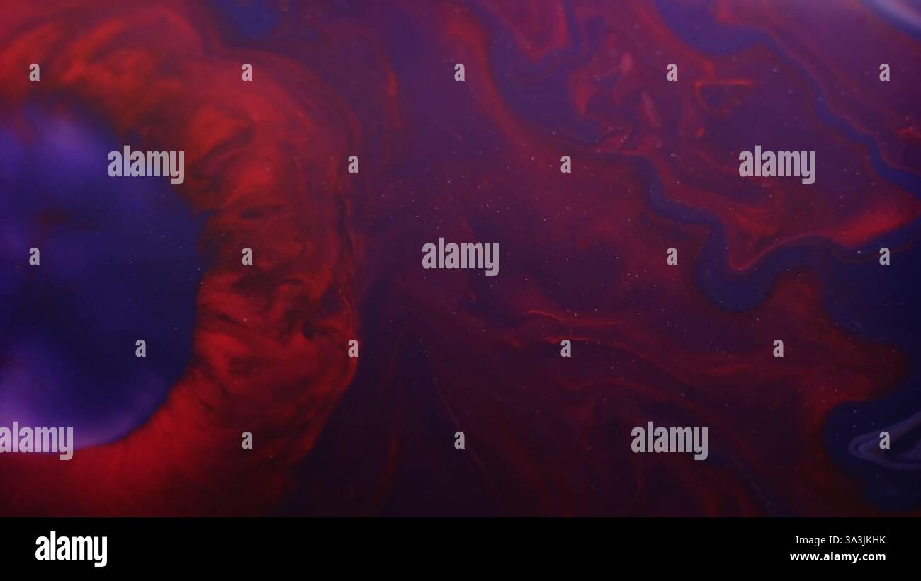 Blend splash. Fluid spill. Defocused purple red colorful paint chemical ...