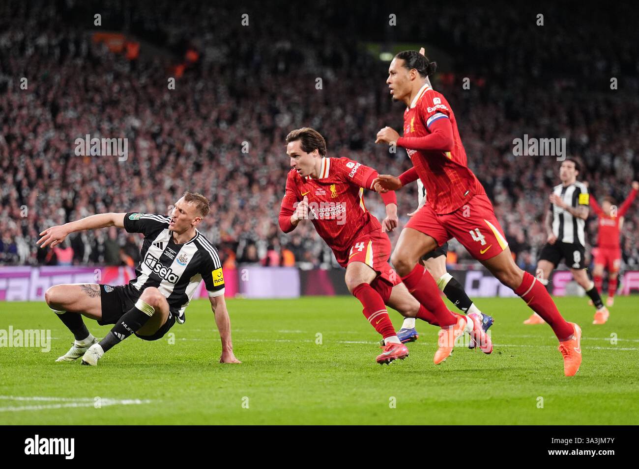 Liverpool's Federico Chiesa (centre) celebrates scoring their side's ...