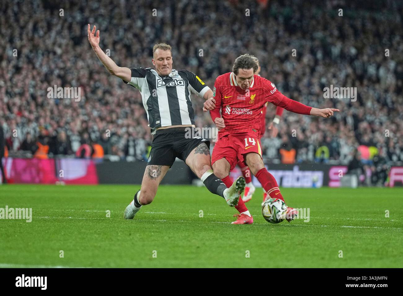 Liverpool's Federico Chiesa, right, scores his side's opening goal ...