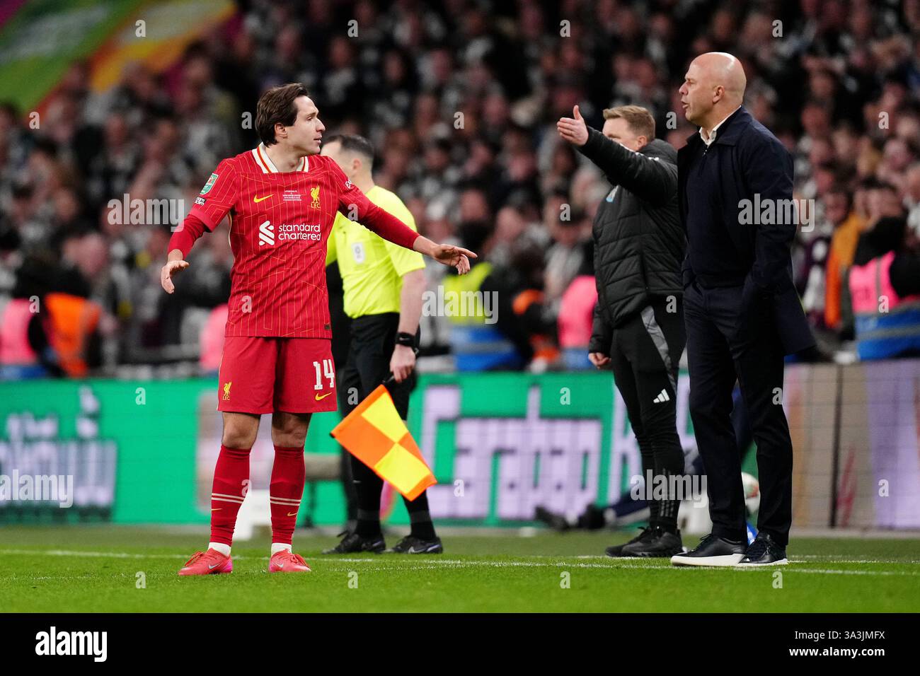Liverpool's Federico Chiesa (left) and manager Arne Slot speak as they ...