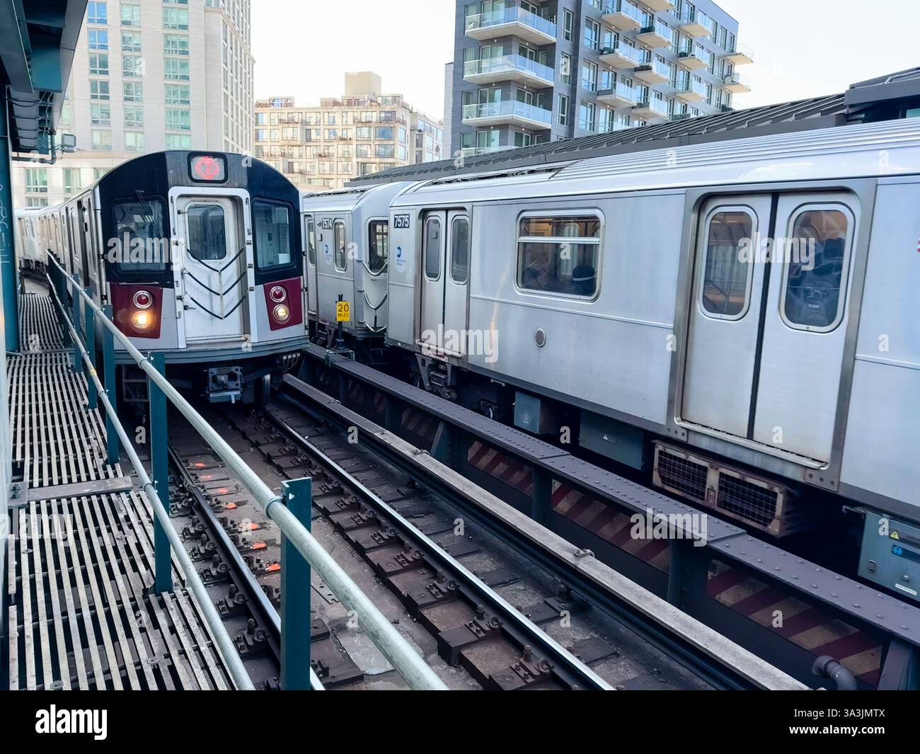 The express 7 train approaches the Court Square Subway Station in Long Island City, Queens, NYC ...