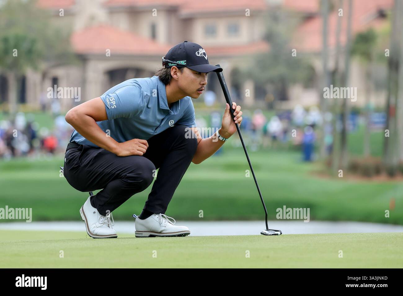 March 16, 2025: Min Woo Lee sizes up his putt on the 3rd hole during the final round of THE ...