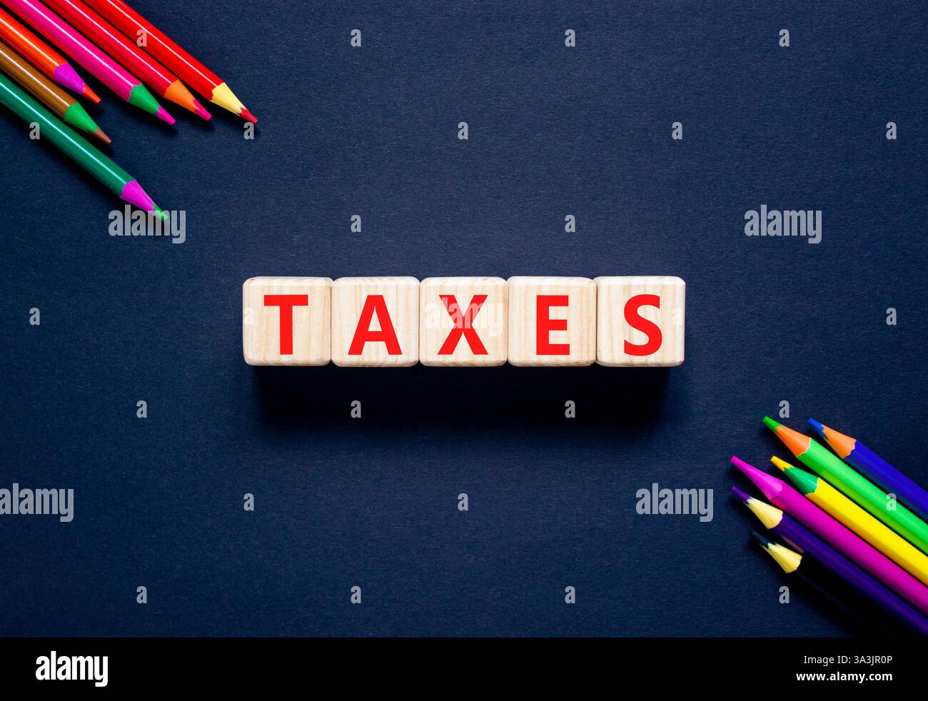 Taxes symbol. Concept word Taxes on beautiful wooden blocks. Beautiful ...