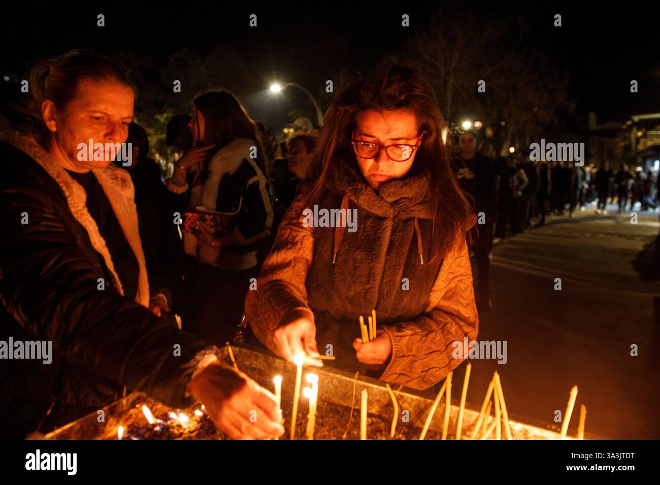 People wait in lines to light candles in the town of Kocani, North ...