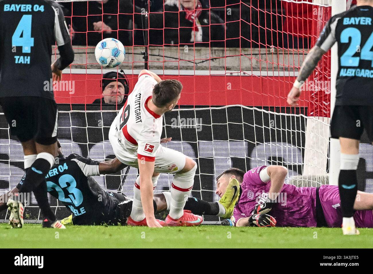 Stuttgart's Ermedin Demirovic, center, scores their side's first goal ...