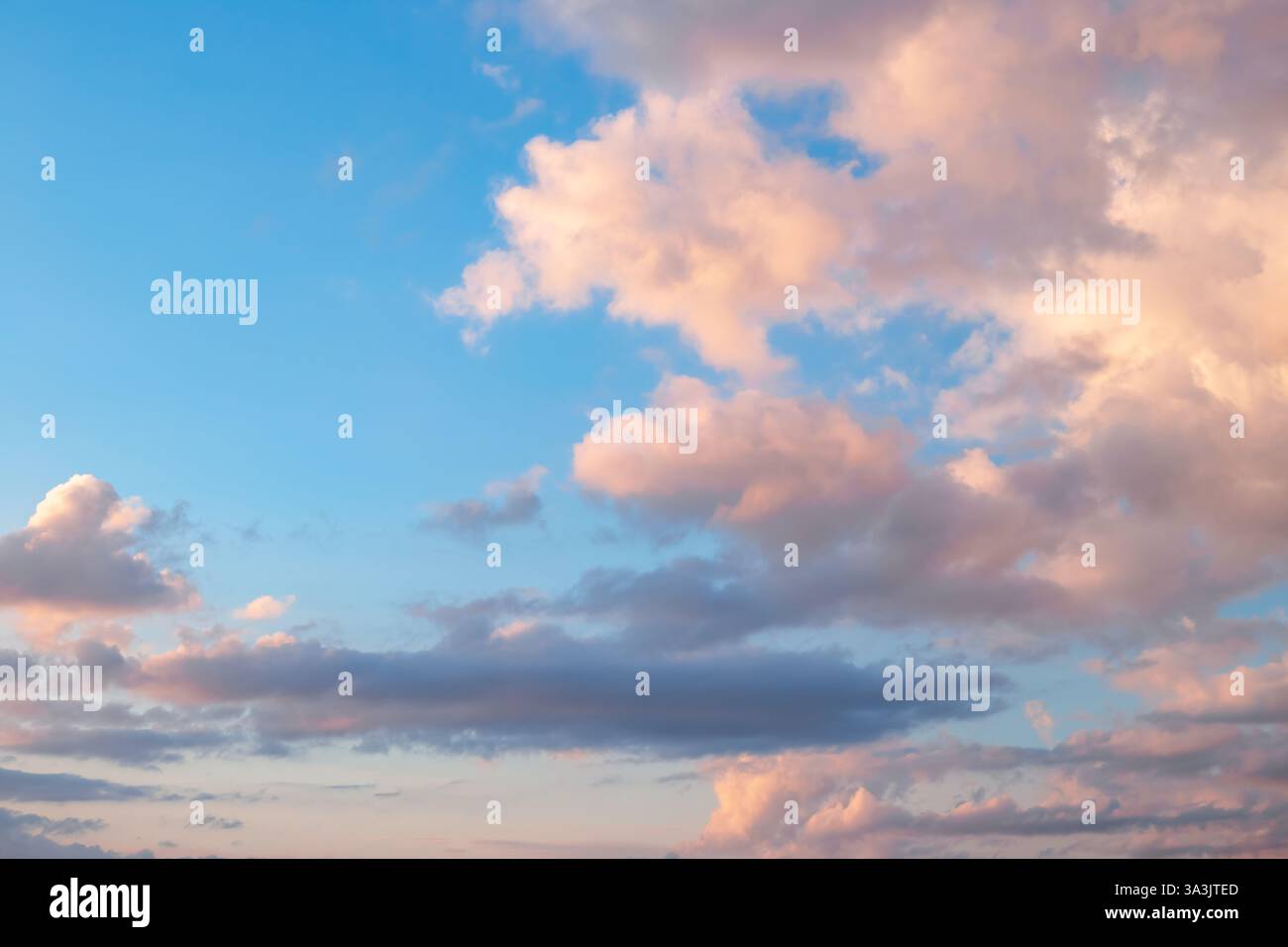 Blue sky with clouds and sunset lighting. Natural cloud landscape ...
