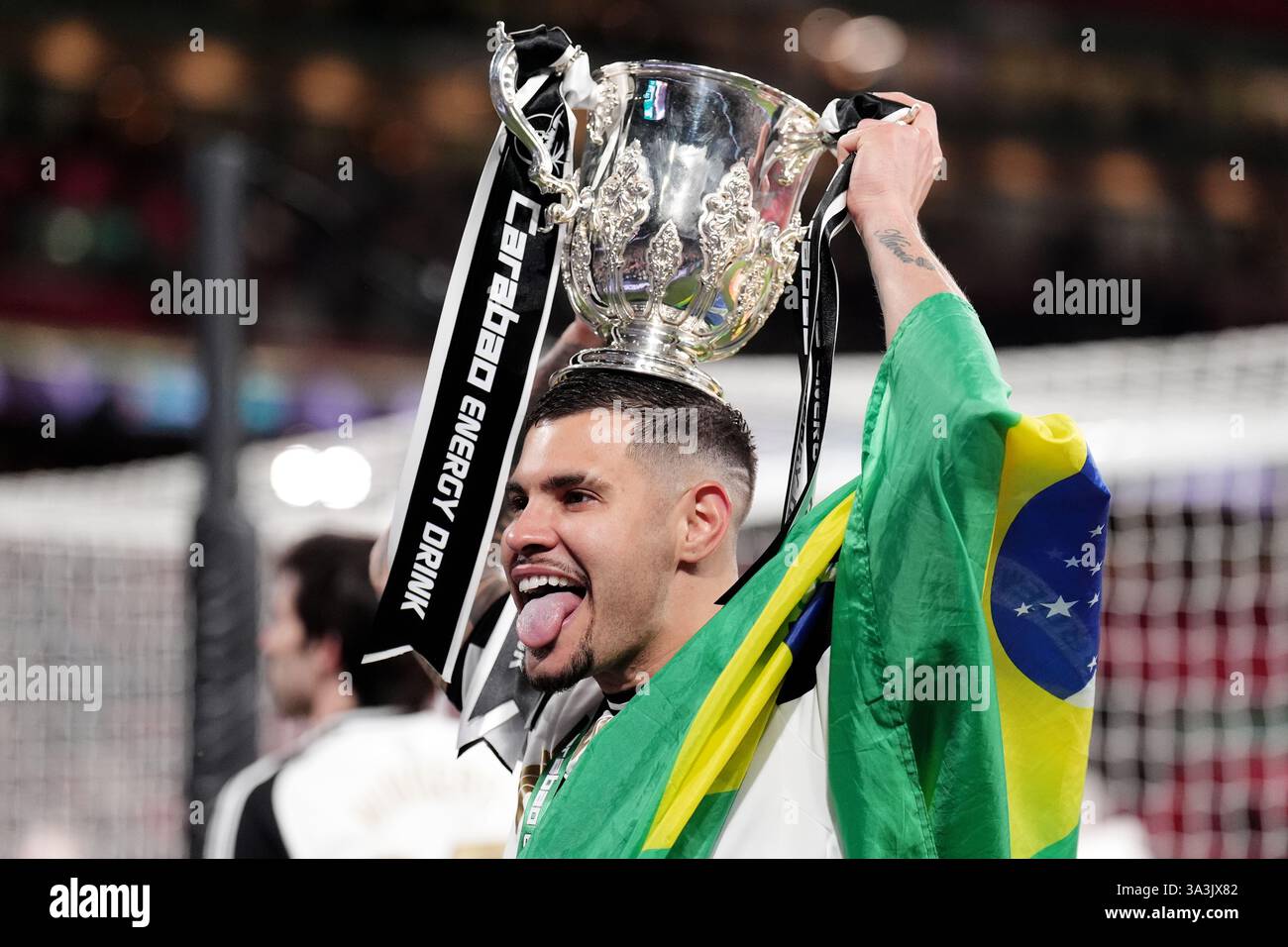 Newcastle United's Bruno Guimaraes celebrates with the trophy after ...