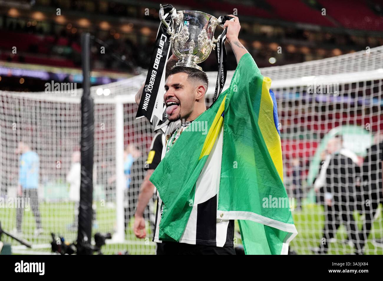 Newcastle United's Bruno Guimaraes celebrates with the trophy after ...