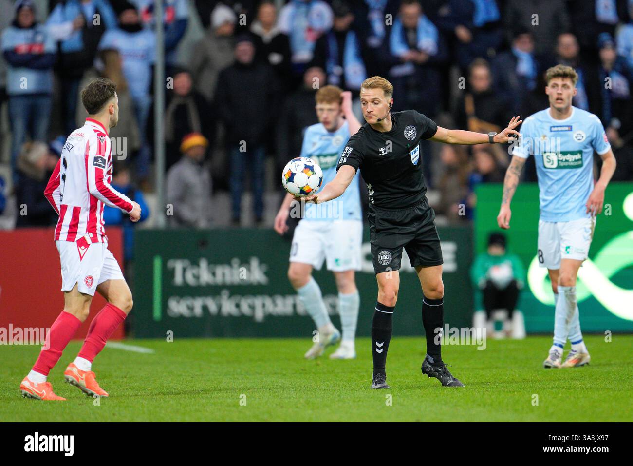 Referee Mikkel Redder performs a drop ball in the Superliga match ...