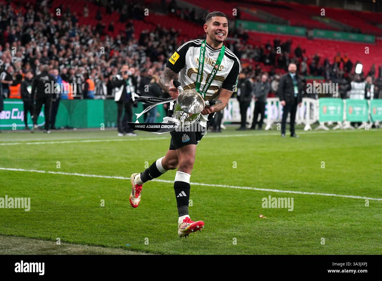 Newcastle United's Bruno Guimaraes celebrates with the trophy following ...