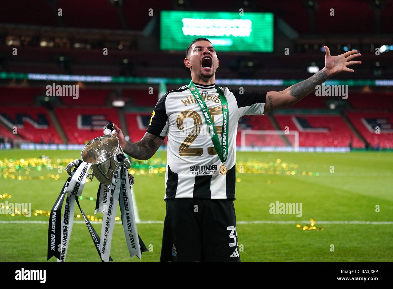 Newcastle United's Bruno Guimaraes celebrates with the trophy following ...