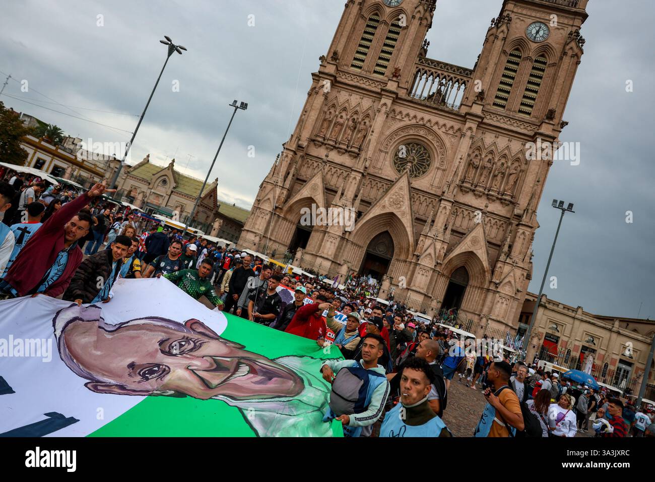 16 March 2025, Argentina, Luján: The faithful gather in front of the ...